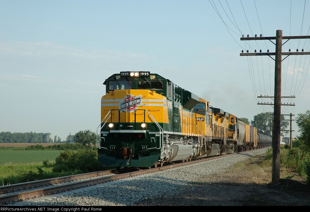 UP 1995 C&NW Heritage unit leads unpatched C&NW 8646 and 8701 westbound